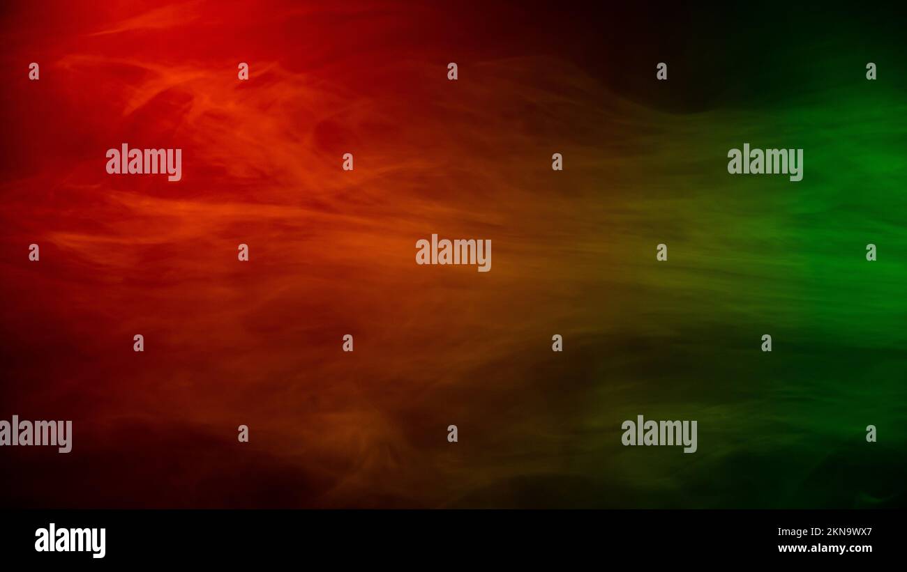 Red yellow green smoke on a black background Stock Photo - Alamy