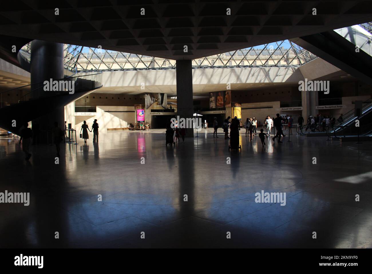 Atrium of the Louvre Museum in summer as the museum is closing Stock ...