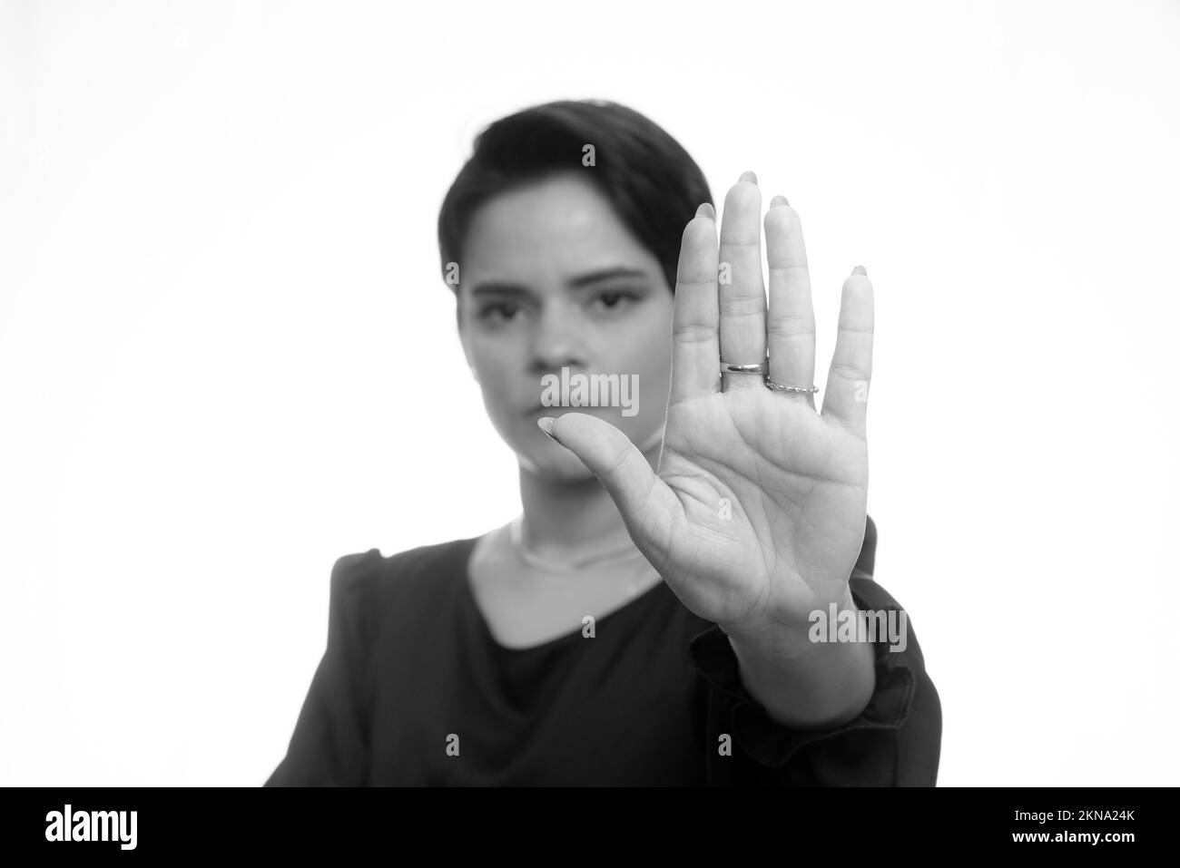 Young, elegant business woman making stop sign with hand. Isolated on ...