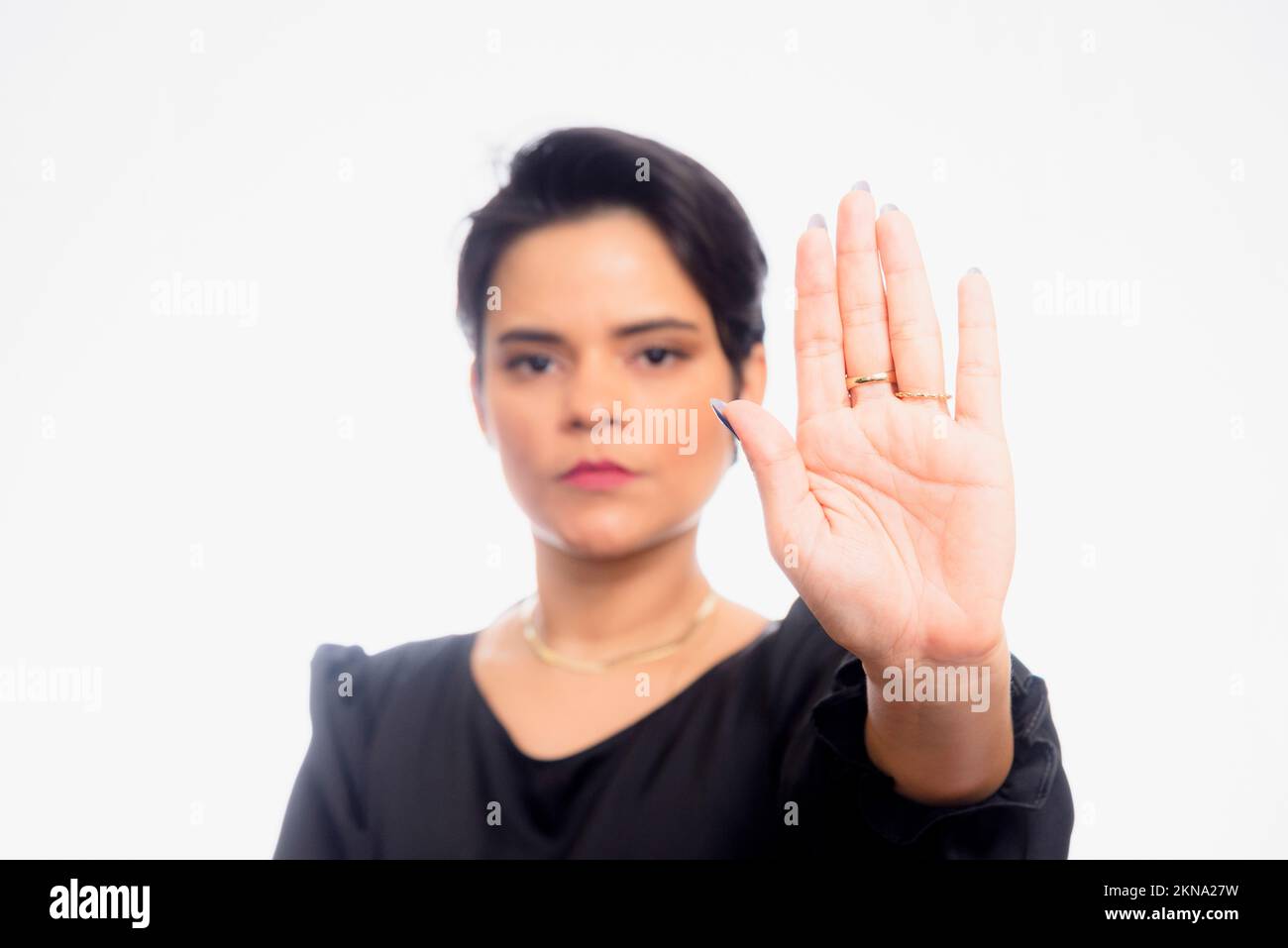 Young, elegant business woman making stop sign with hand. Isolated on ...