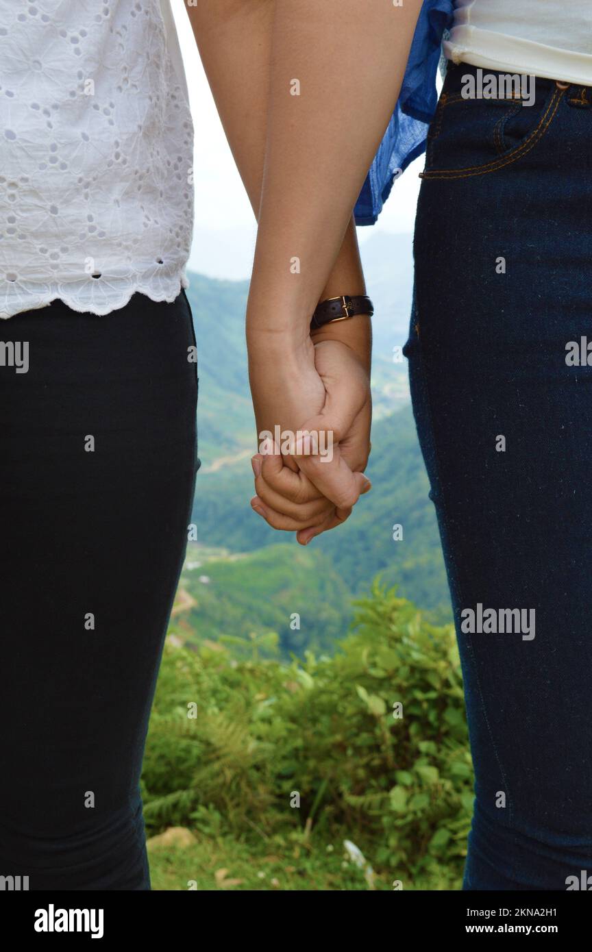 Couple holding hands in the background of Sapa Village, Vietnam Stock ...