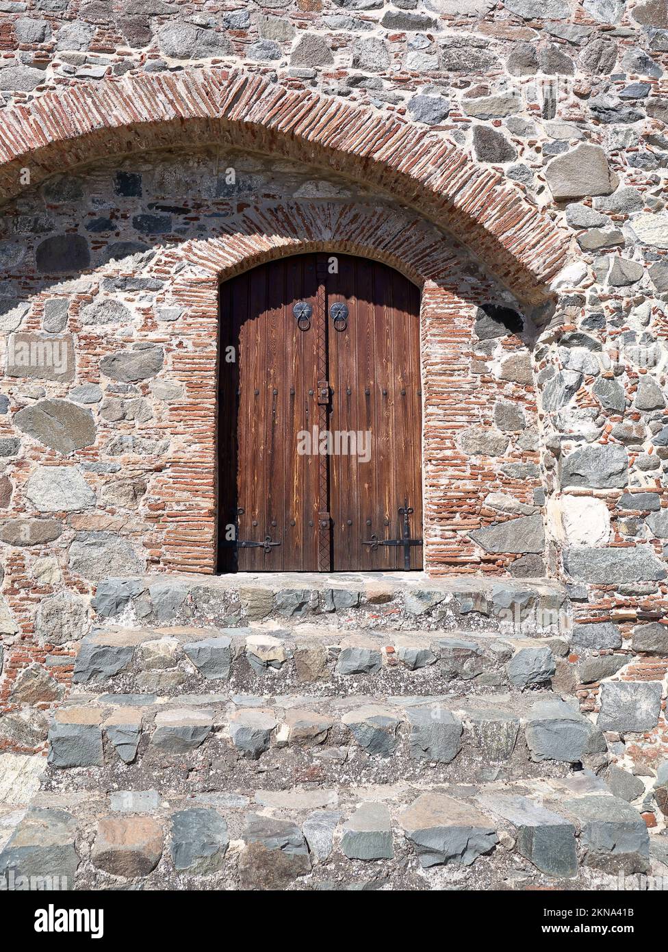 Traditional building in Cyrpsu, build of stones, stairs, wooden door ...
