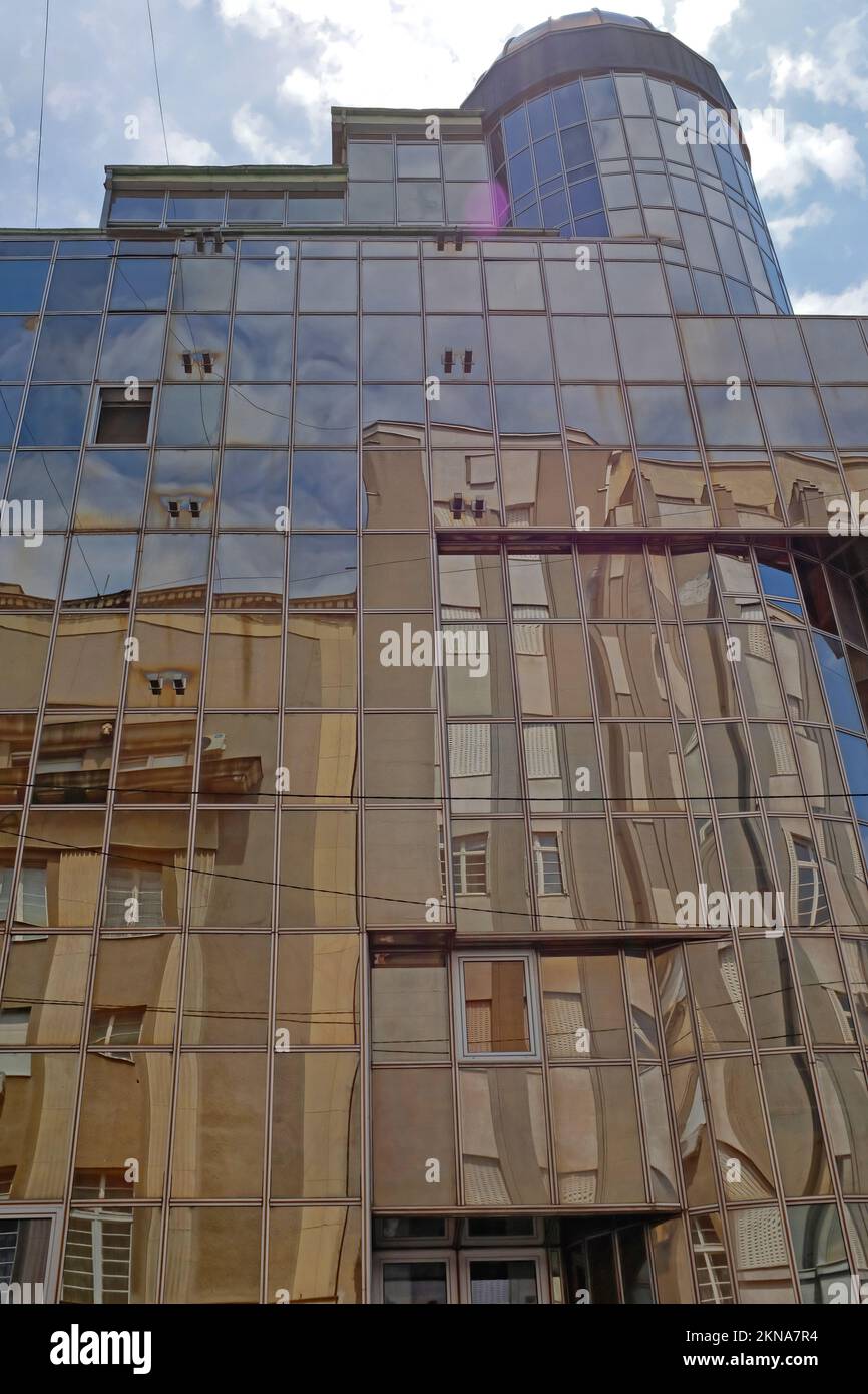 Architecture glass reflections of old buildings in new brown glass ...