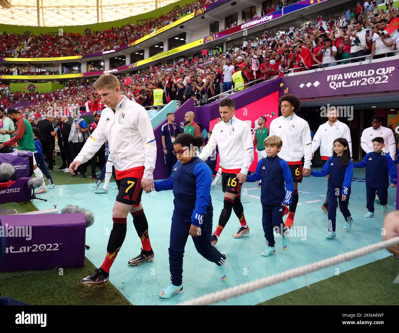 Belgium's Kevin De Bruyne walks out to the pitch with a mascot during ...