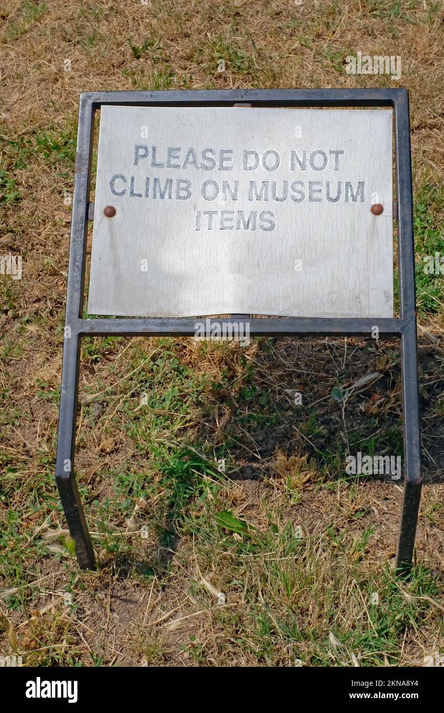 Please do not climb on museum items sign board in park Stock Photo - Alamy