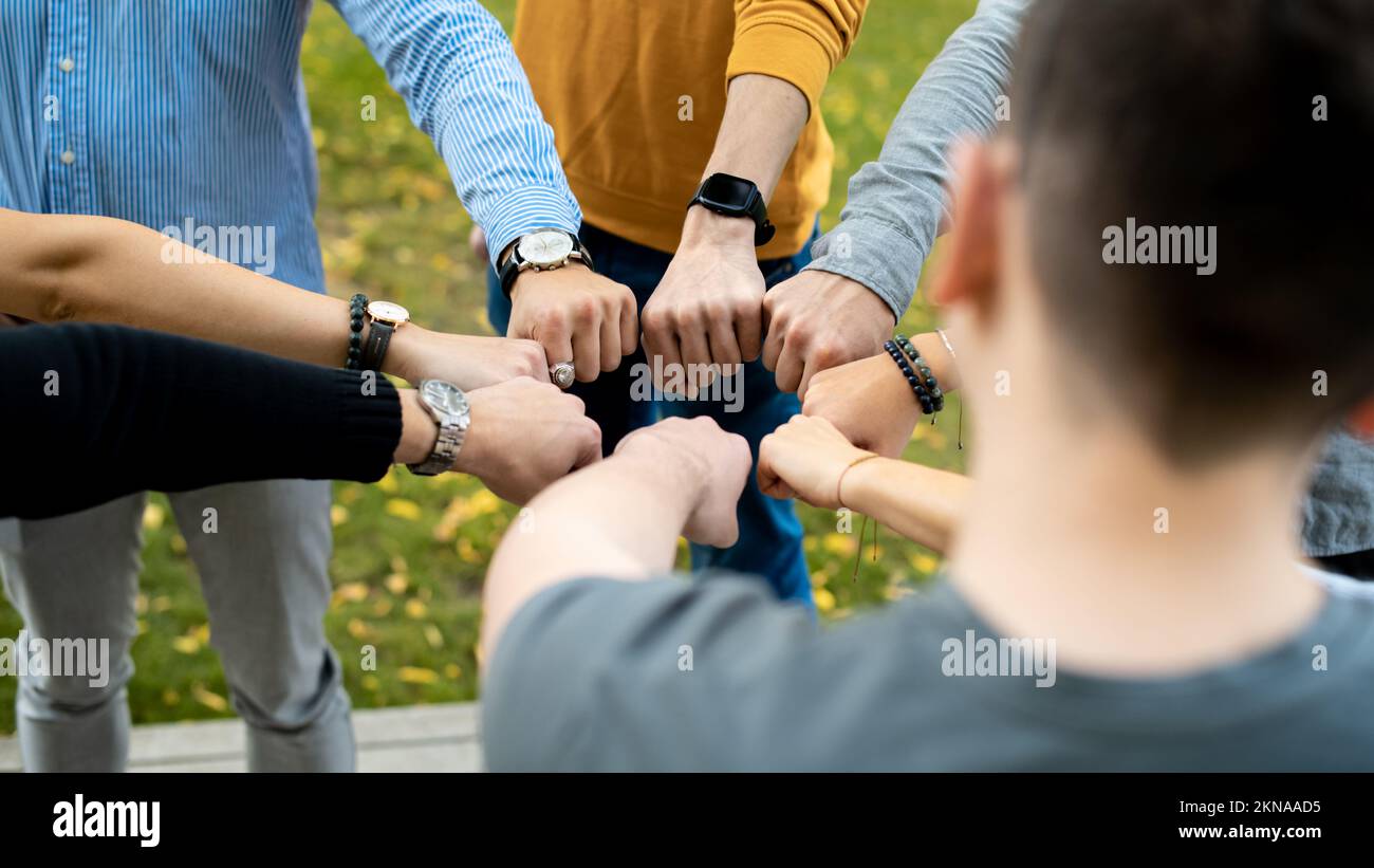 A group of people showing their fists off together as a teamwork Stock ...