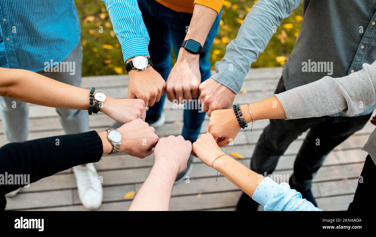 A group of people showing their fists off together as a teamwork Stock ...
