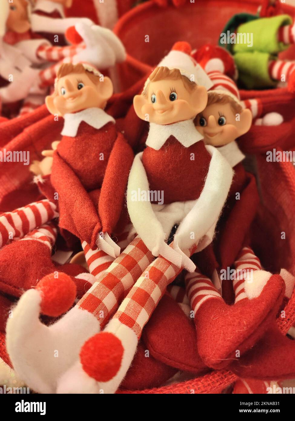 A closeup of cute toys of elf in red color Stock Photo - Alamy