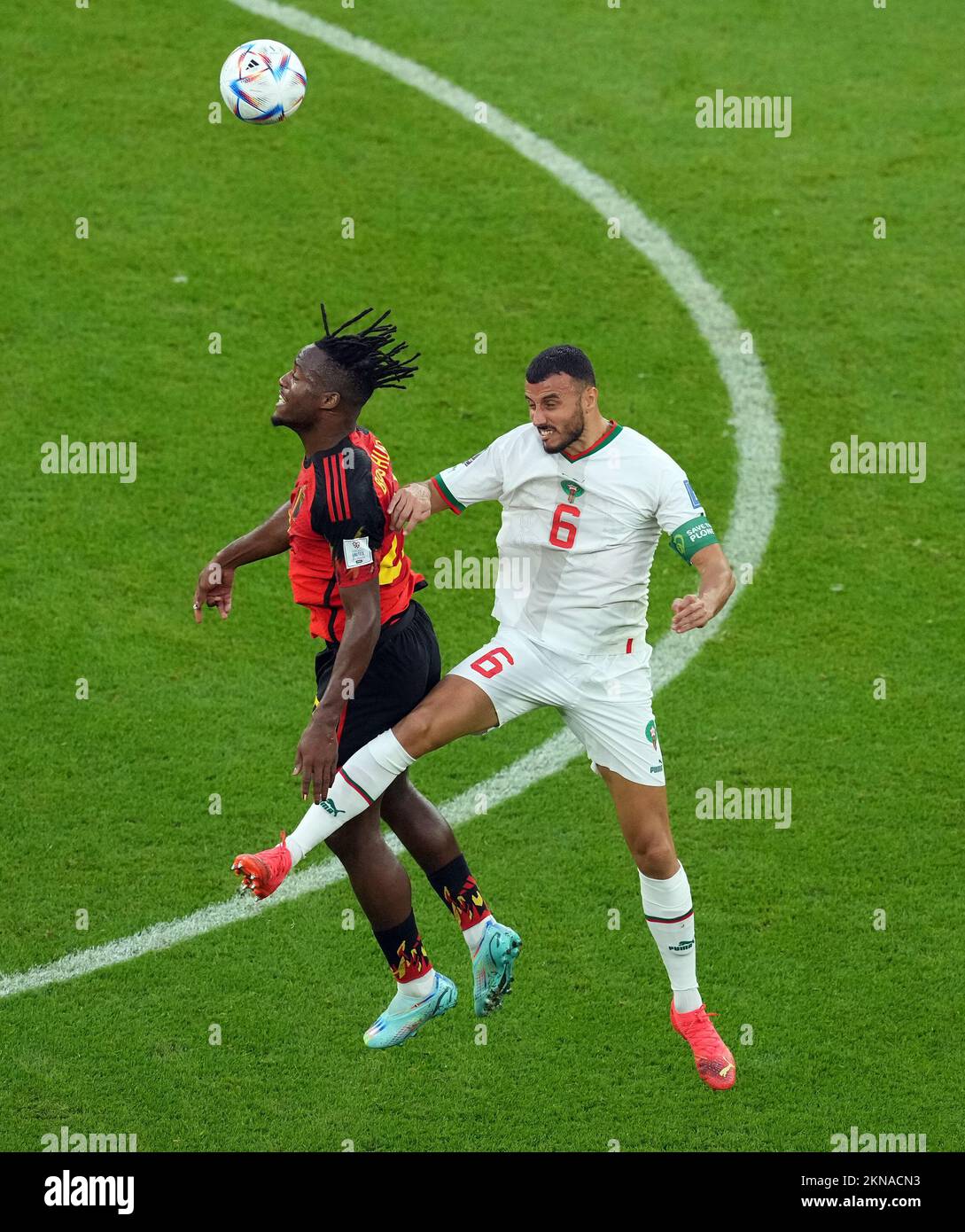Belgium's Michy Batshuayi and Morocco's Romain Saiss (right) battle for ...