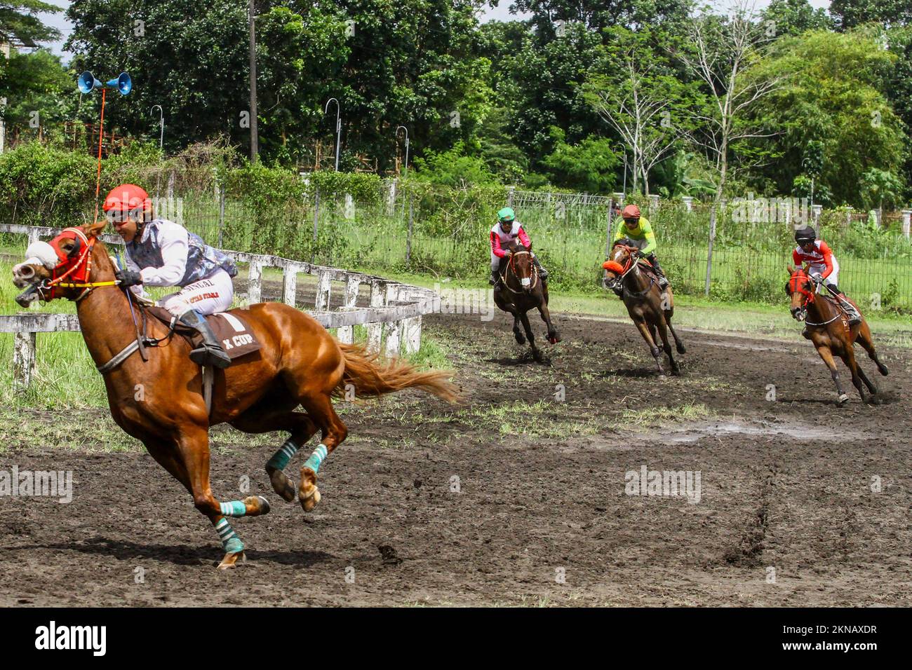 Bantul, Indonesia. 27th Nov, 2022. Jockeys saw spurring his horse ...