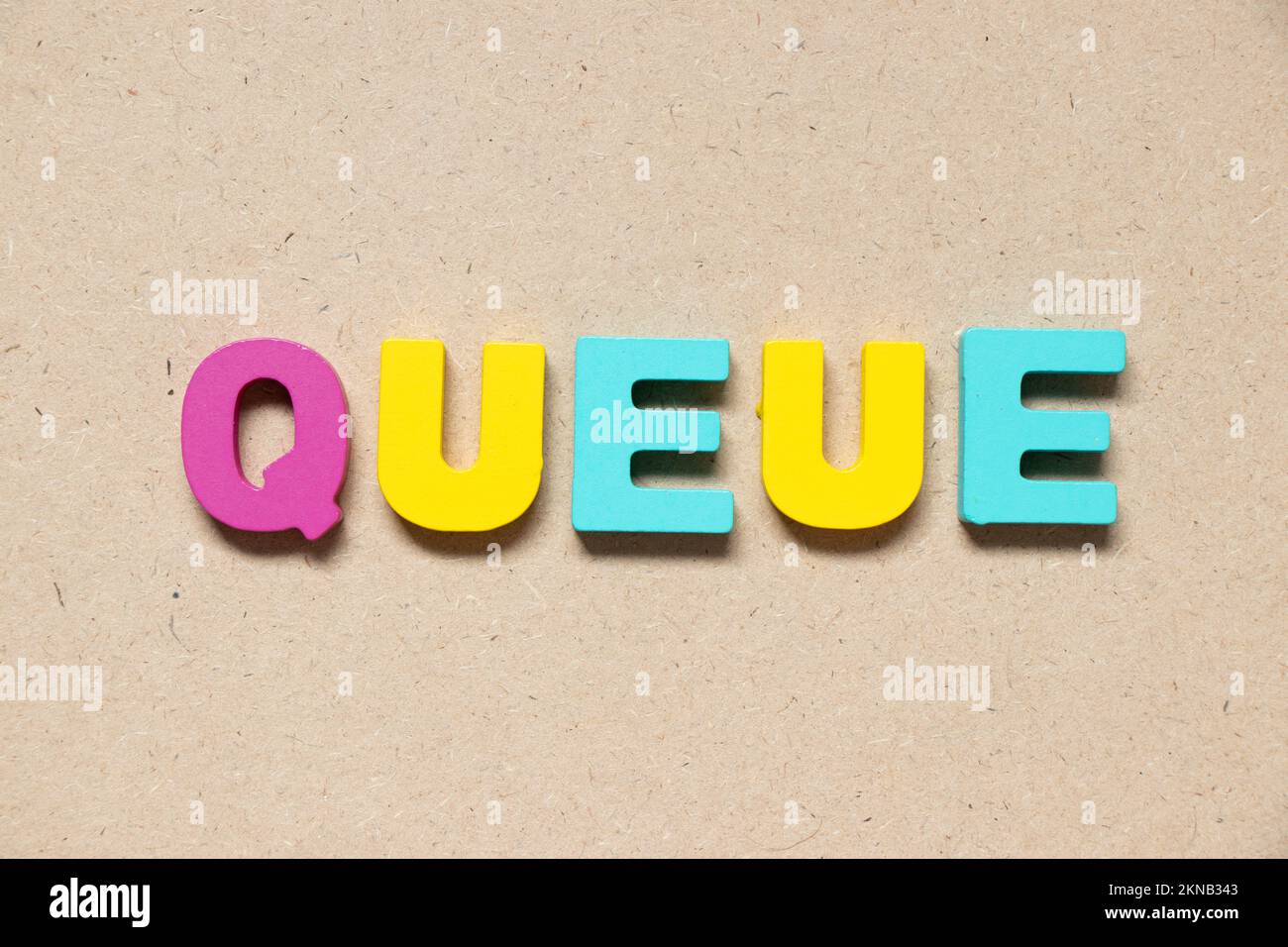 Color alphabet letter in word queue on wood background Stock Photo - Alamy