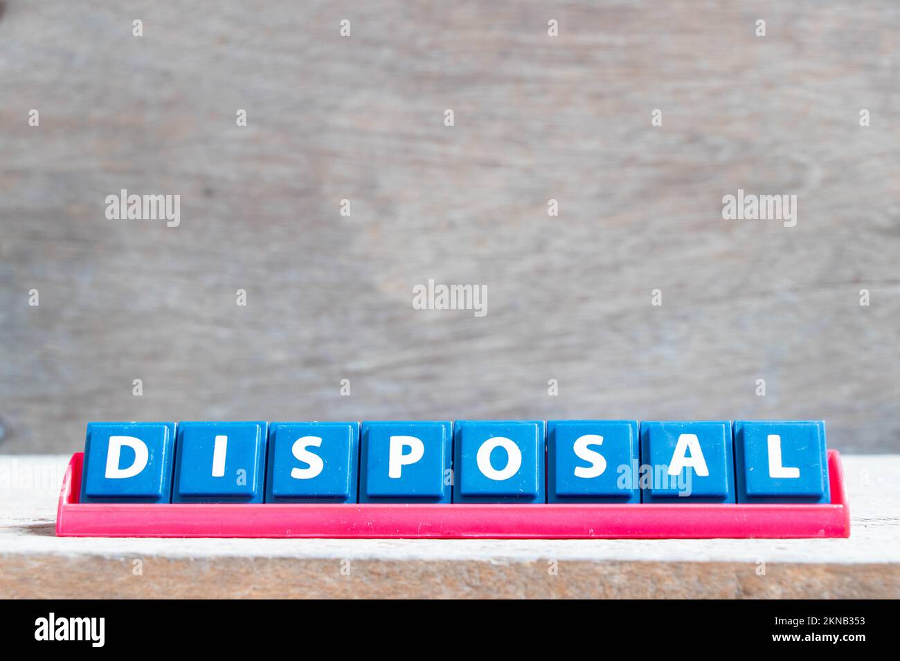 Tile alphabet letter with word disposal in red color rack on wood ...