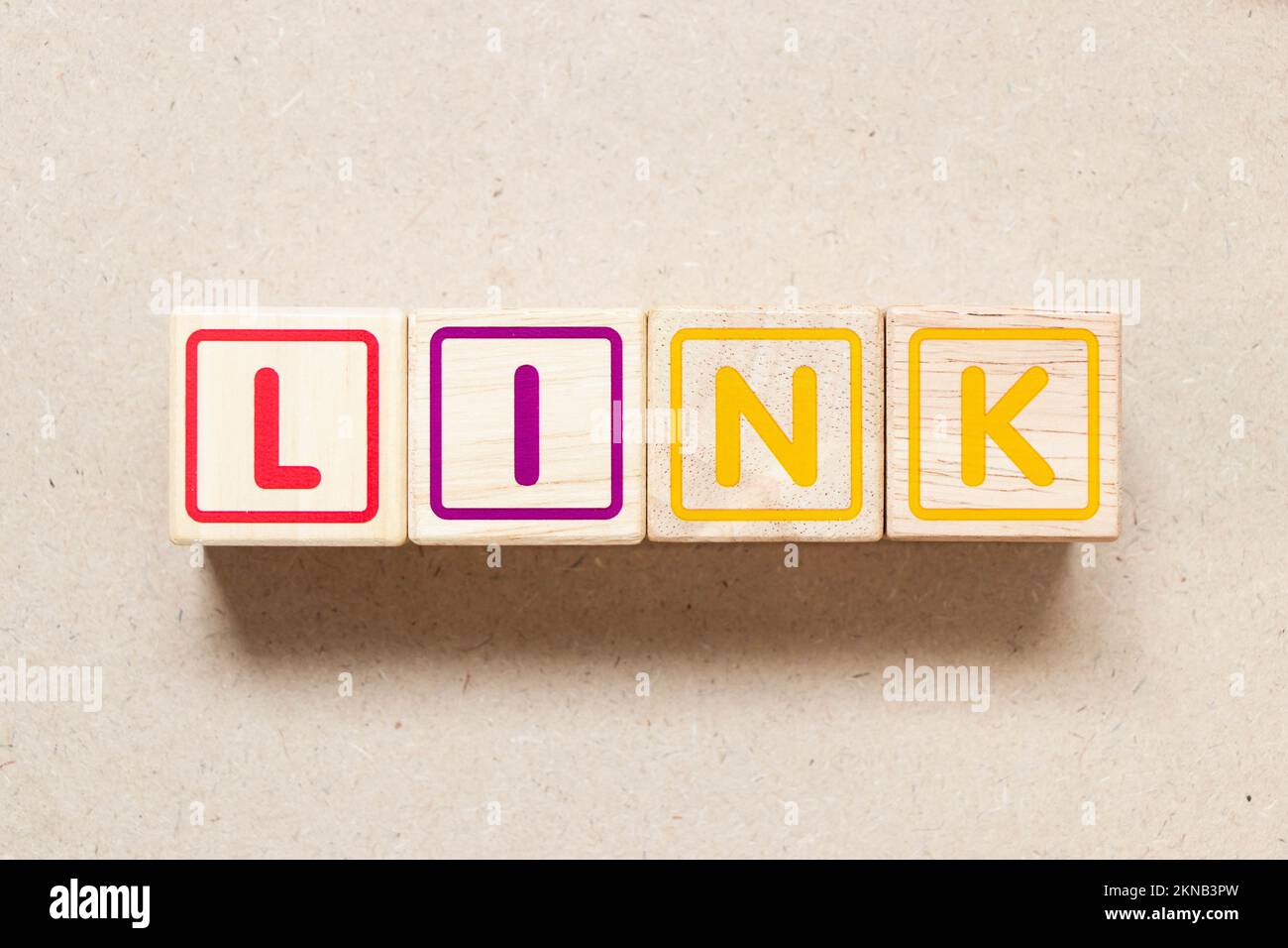 Color letter block in word link on wood background Stock Photo - Alamy