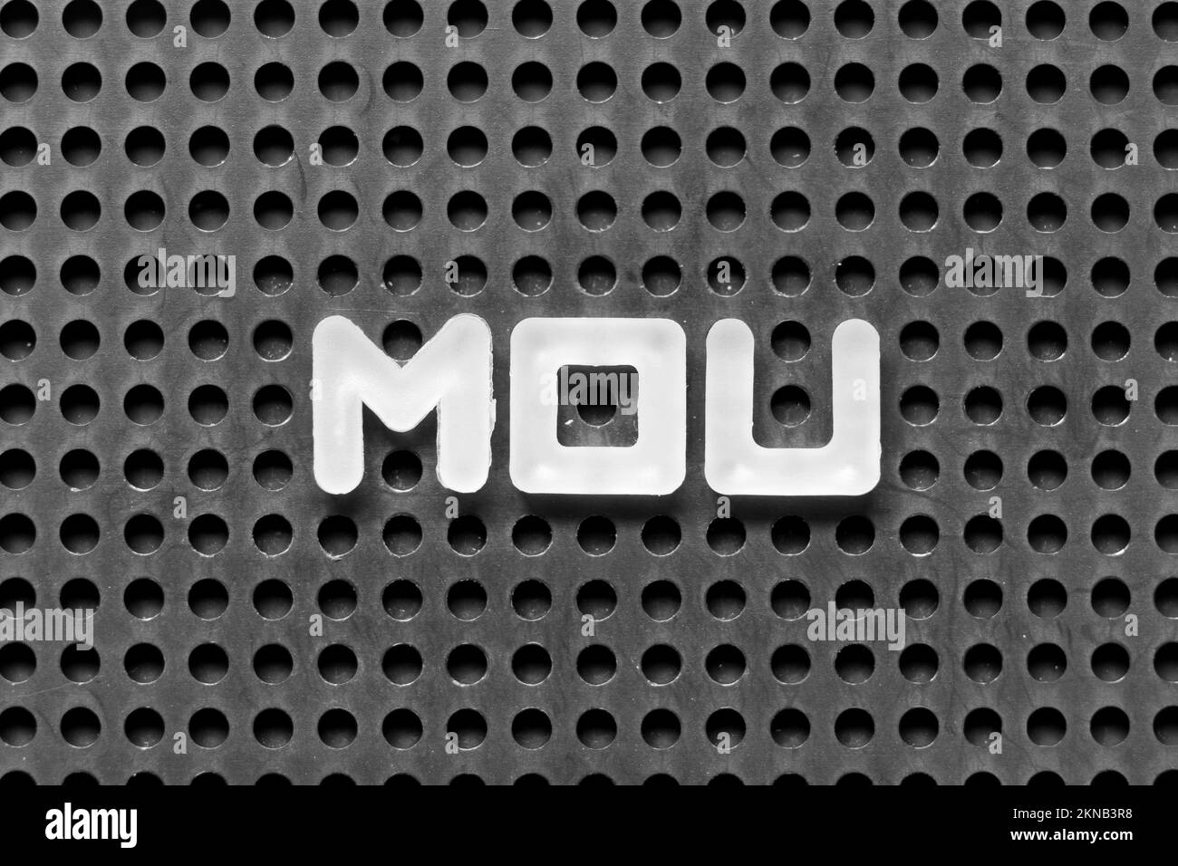 White alphabet letter in word MOU (Abbreviation of memorandum of ...