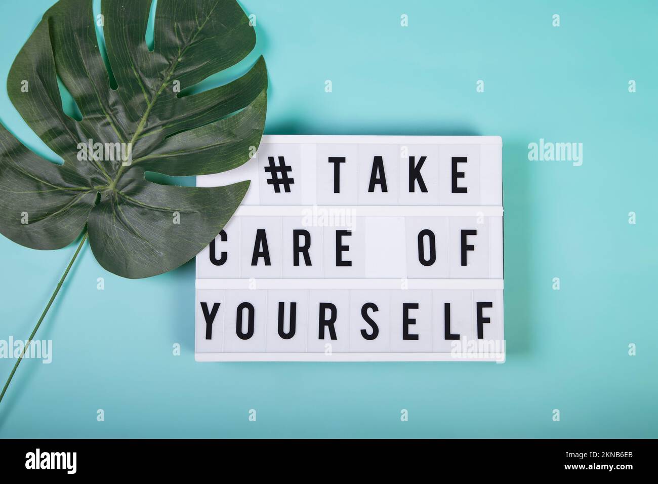 A top view of a lightbox with motivational words for self-care, mental ...