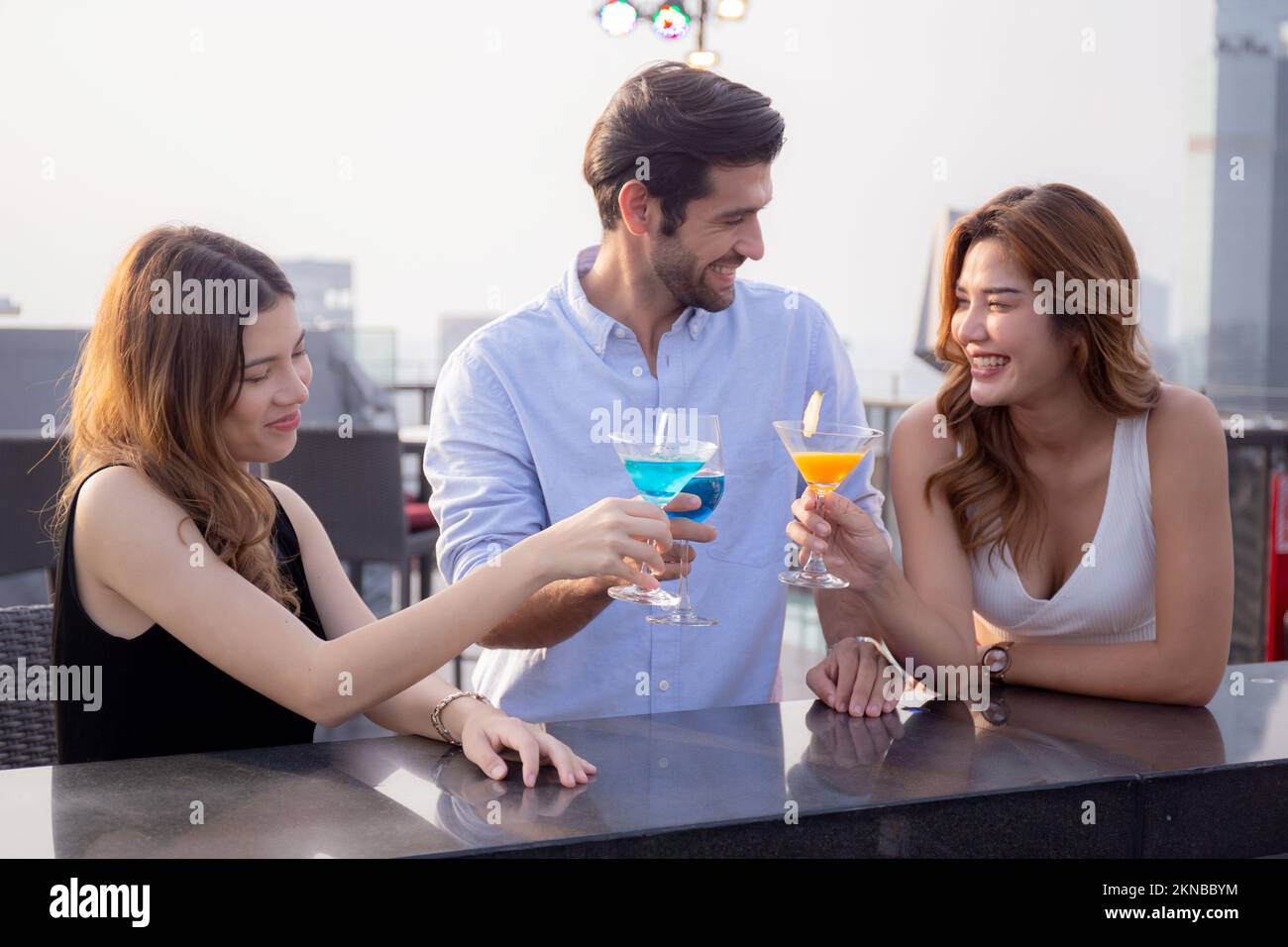 Group friends drinking cocktail and cheer in party at restaurant luxury ...