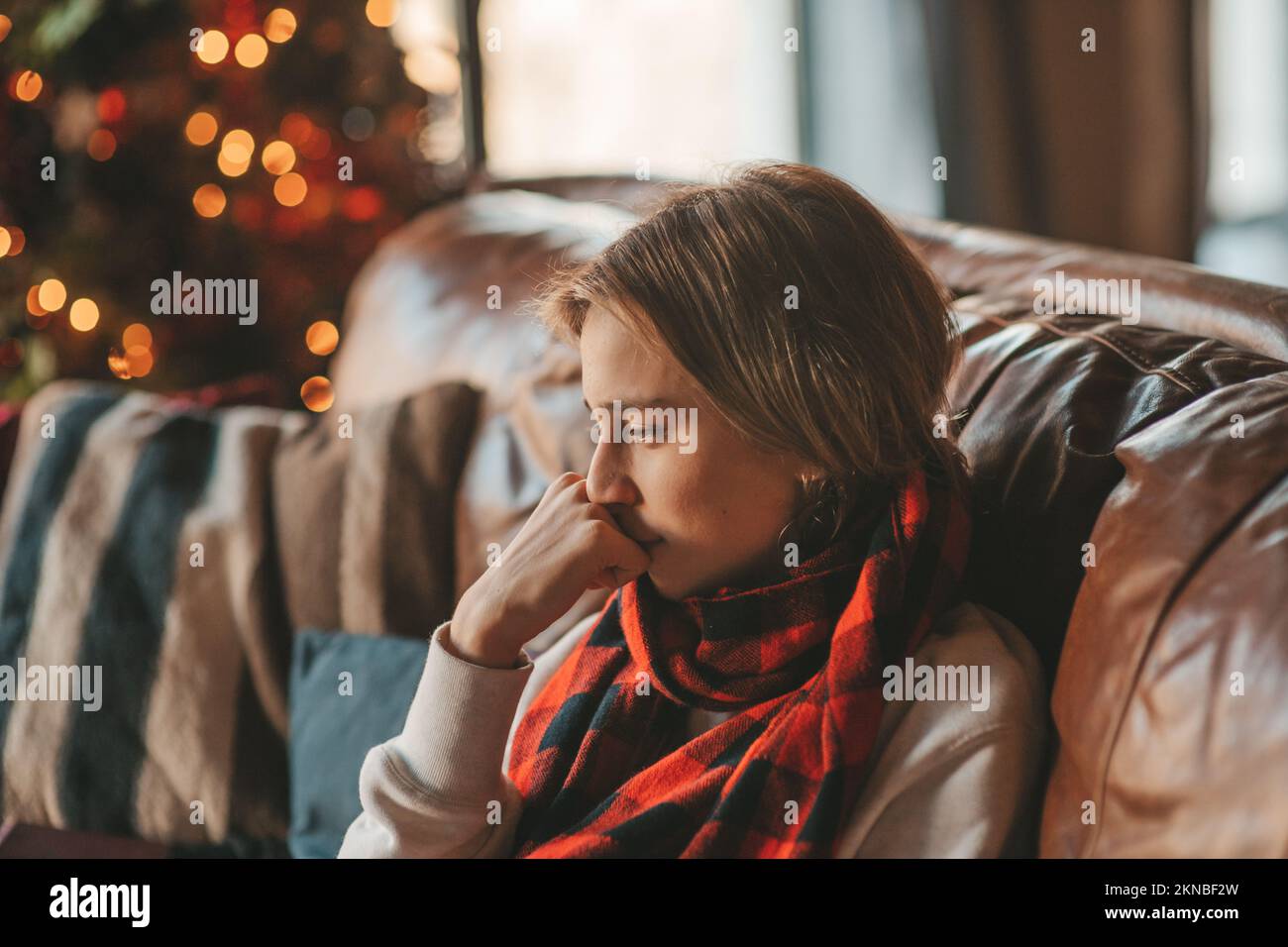 Young teen boy with long hair thoughtful look sad eyes negative mood ...