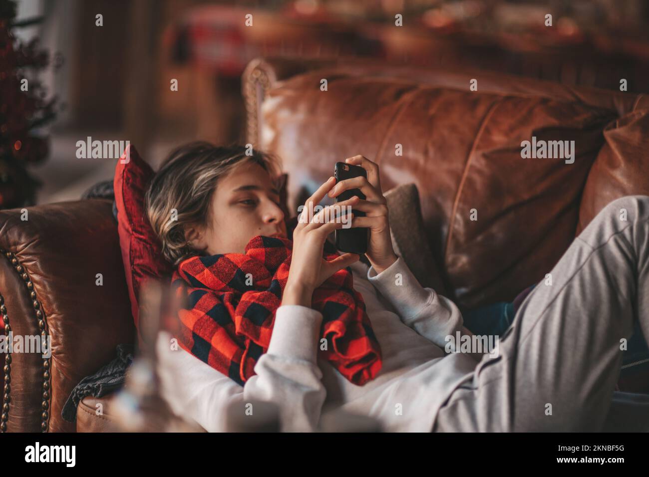 Young teen boy with long hair thoughtful look sad eyes negative mood ...
