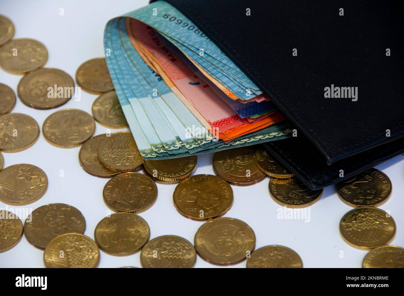 Close up of various Malaysia Ringgit currency with gold coins. Money ...