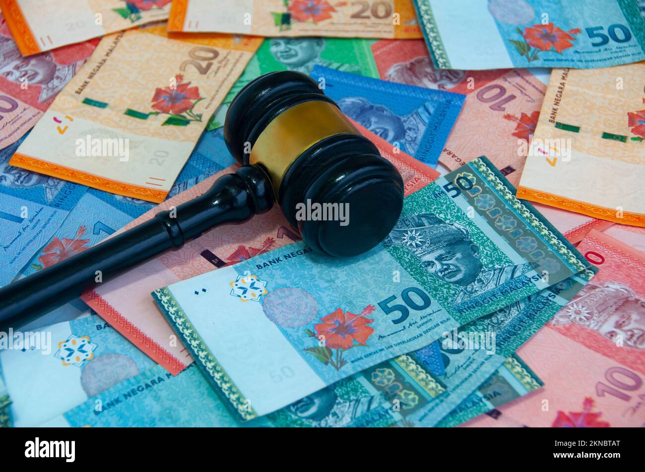 Top view of various Malaysia Ringgit currency with gavel. Money concept ...