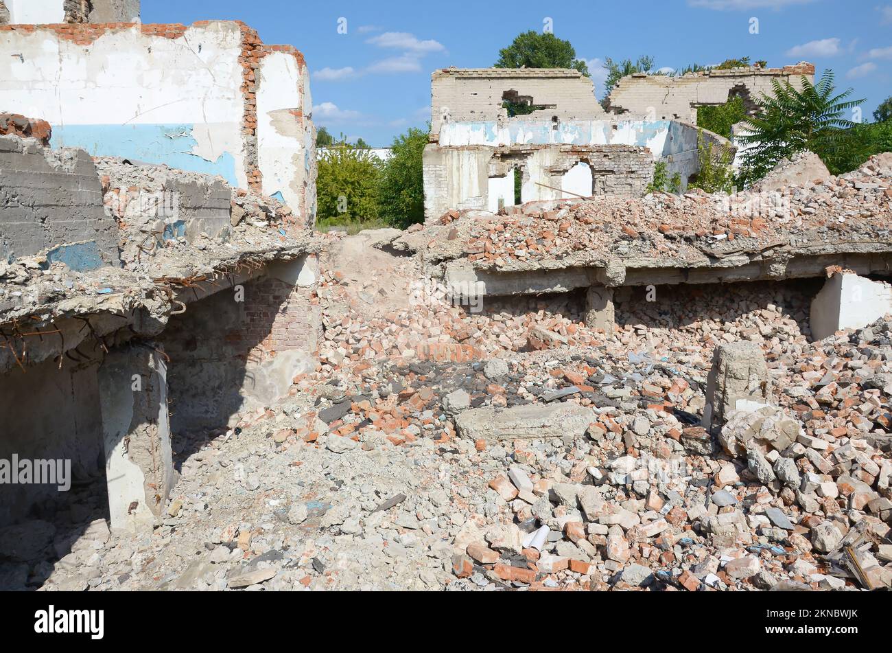 Collapsed industrial multistorey building in daytime. Disaster scene ...