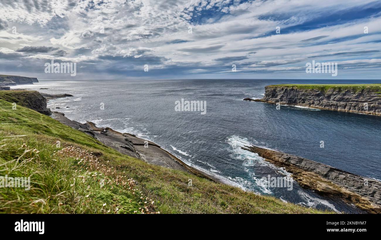 Wild cliffs near Dunmore Head at the Ring of Kerry, Atlantic water way ...