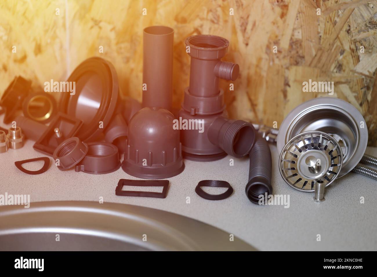 Plumbers tools and water tap ready for installation near sink on ...