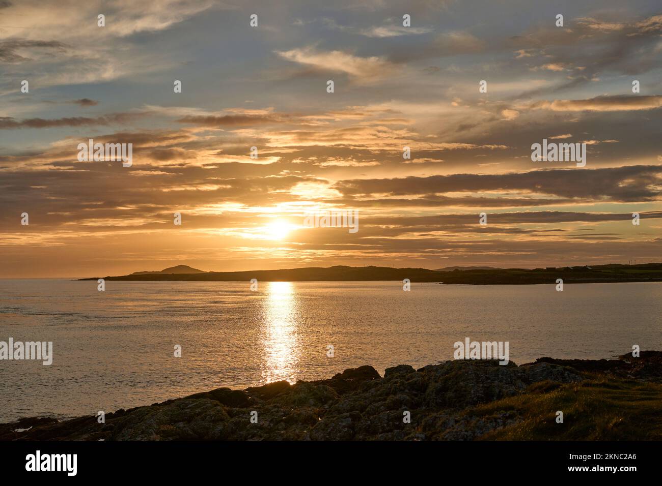 sunset with dramatic cloud sky at Clifton beach in county Galway ...