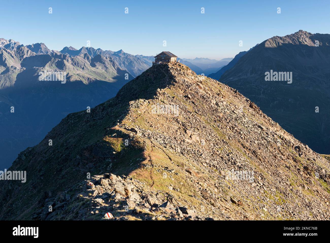 Sunrise over the alpine mountain hut on the Brunnenkogel summit and ...