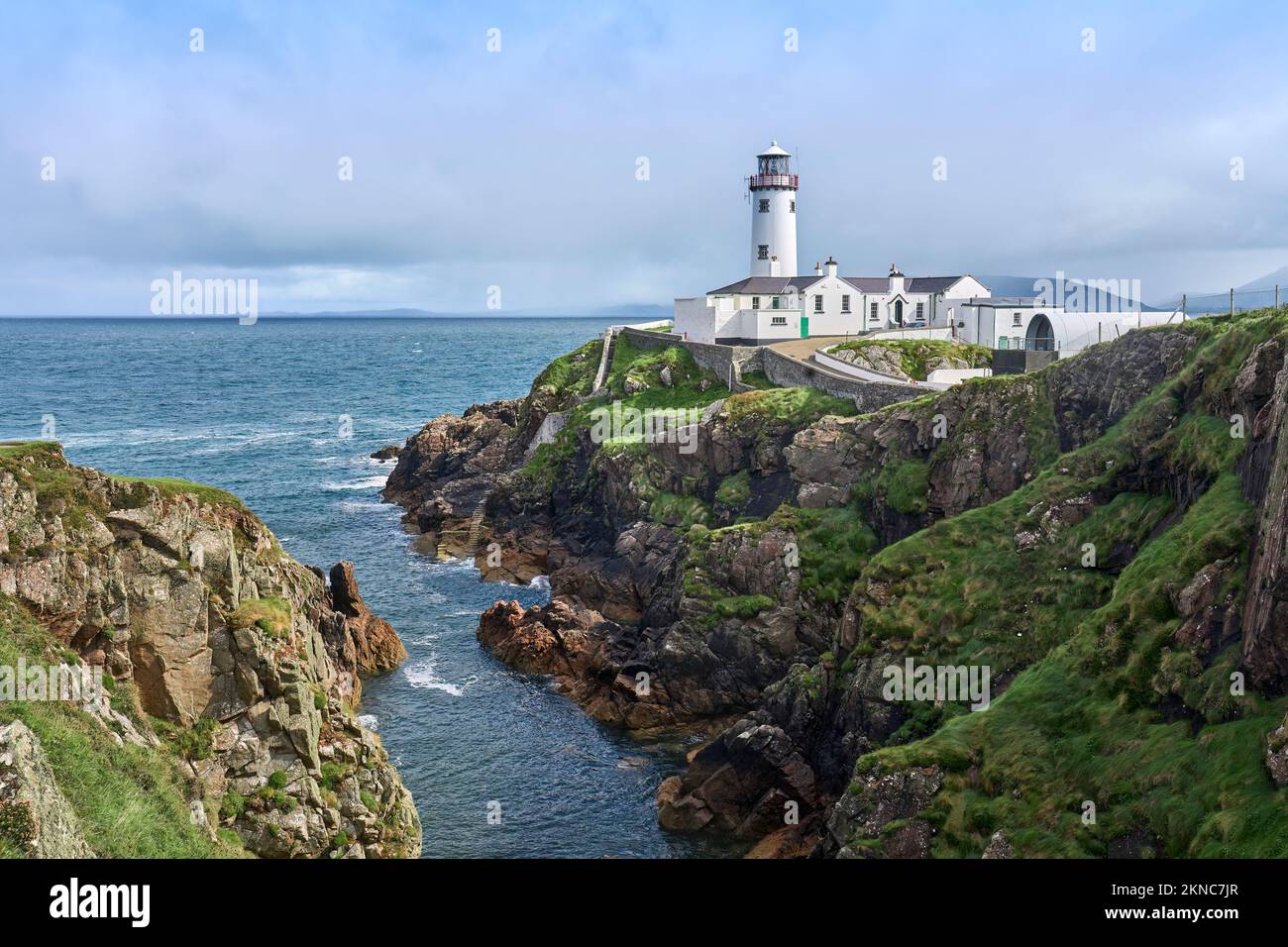 Fanad Head Lighthouse with its rough cliffs in the northern part of ...
