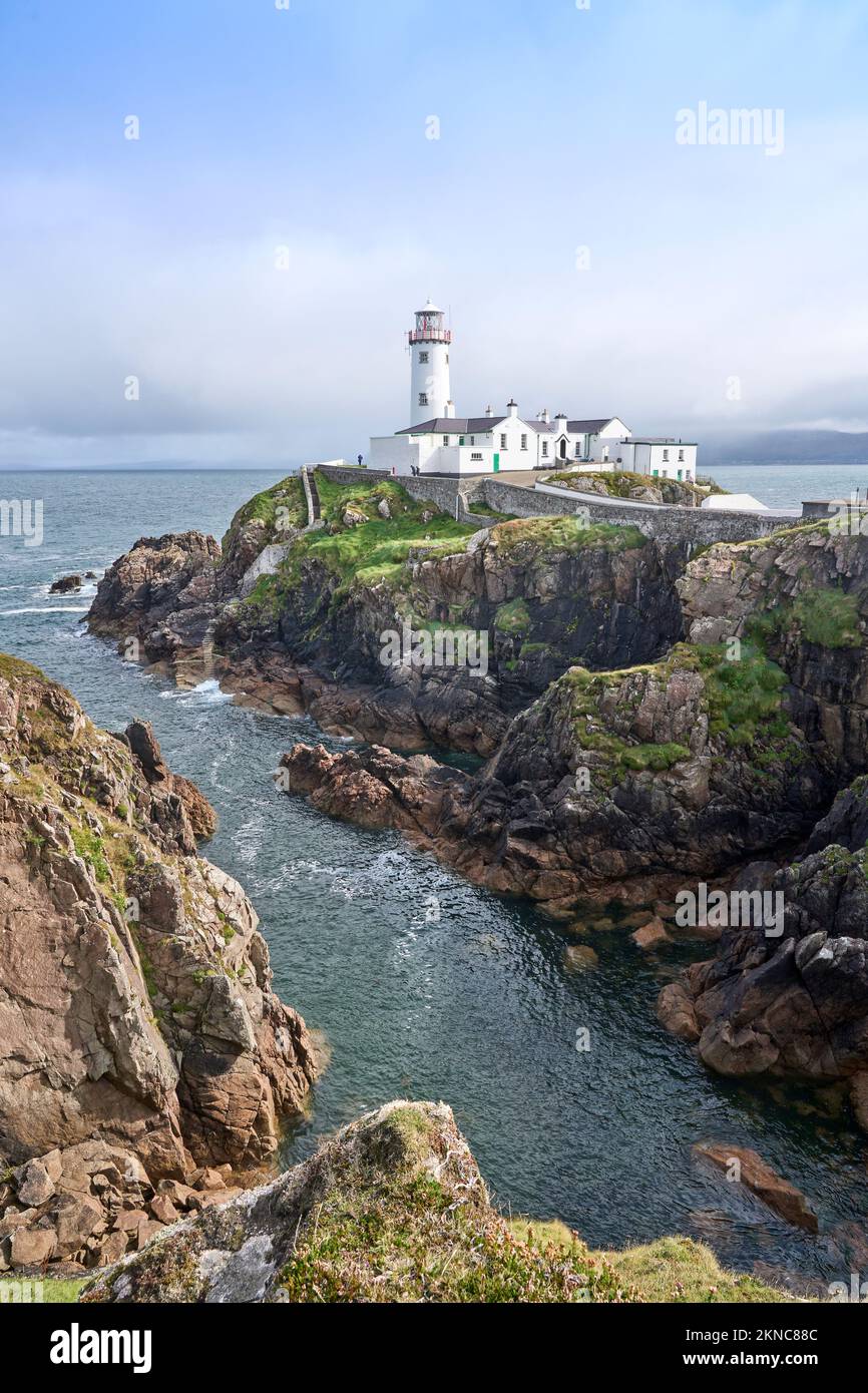 Fanad Head Lighthouse with its rough cliffs in the northern part of ...