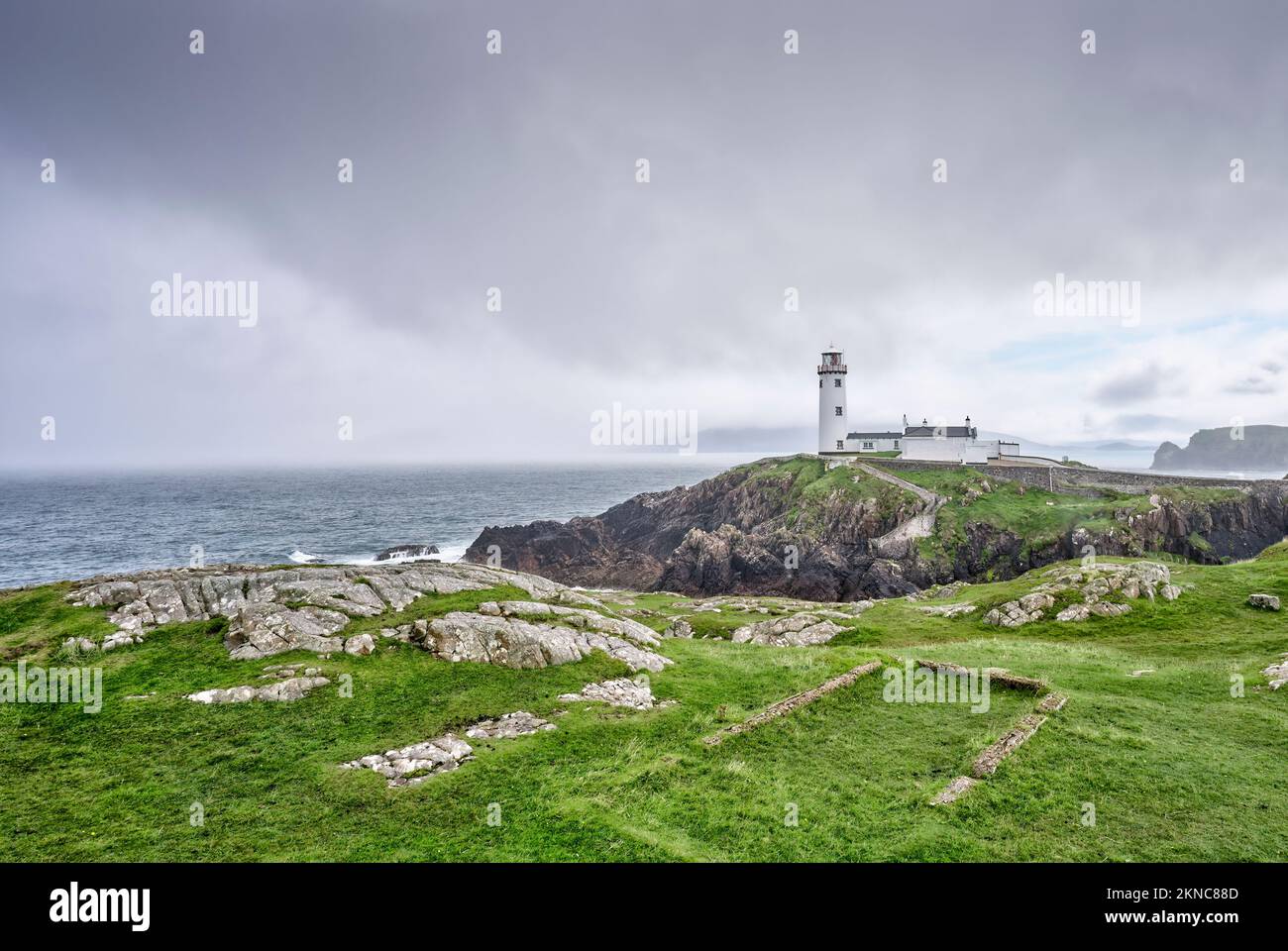 Fanad Head Lighthouse with its rough cliffs in the northern part of ...