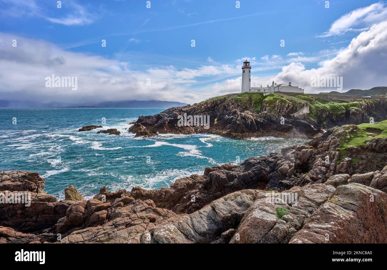 Fanad Head Lighthouse with its rough cliffs in the northern part of ...