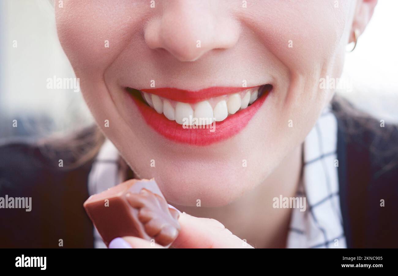 Woman on lips eating candy hi-res stock photography and images - Alamy