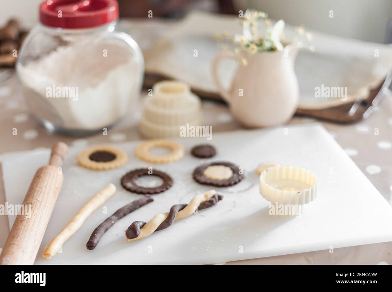 Cookies of different shapes and a jug with a sprig of linden Stock ...