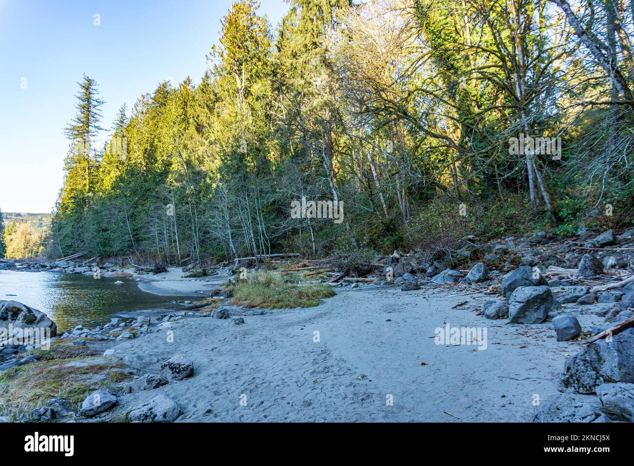 Large rocks line the Snoqaulmie River in Washington State Stock Photo ...