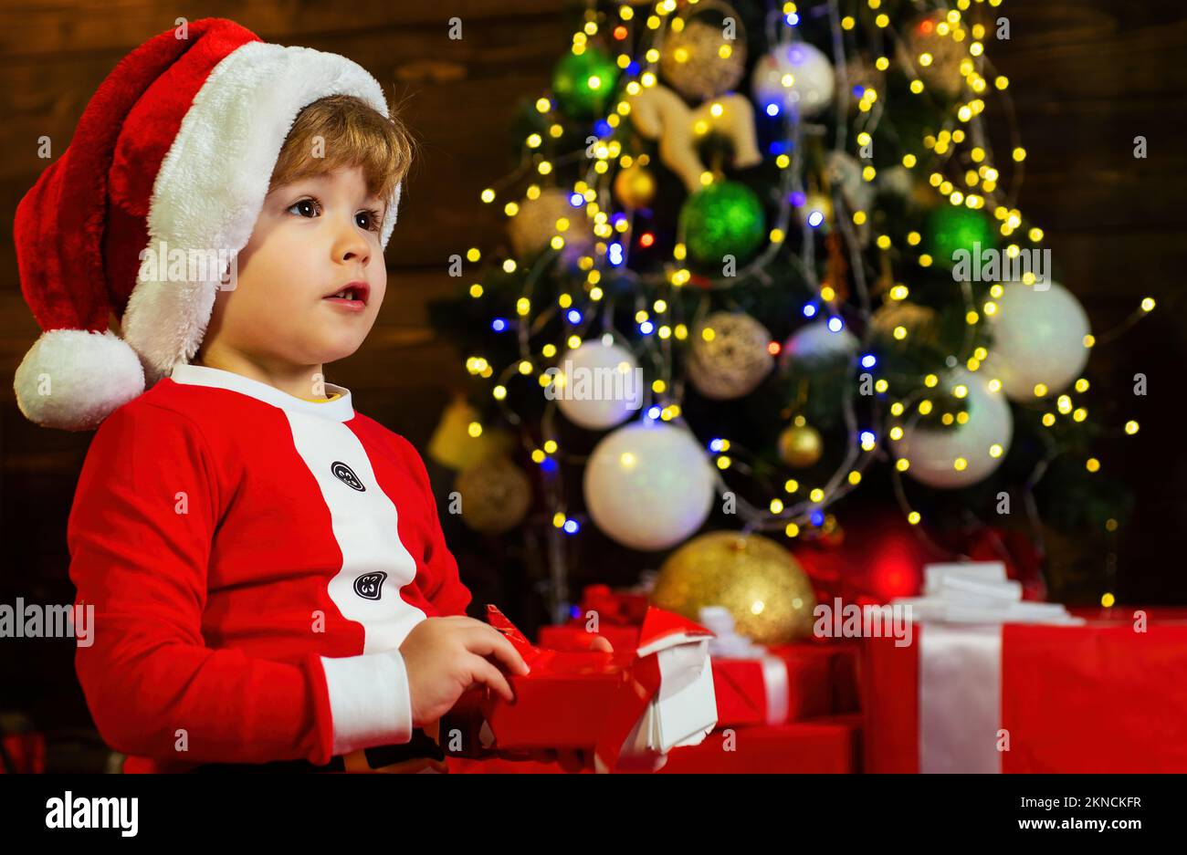 Christmas children. Christmas child holding a red gift box. Christmas ...