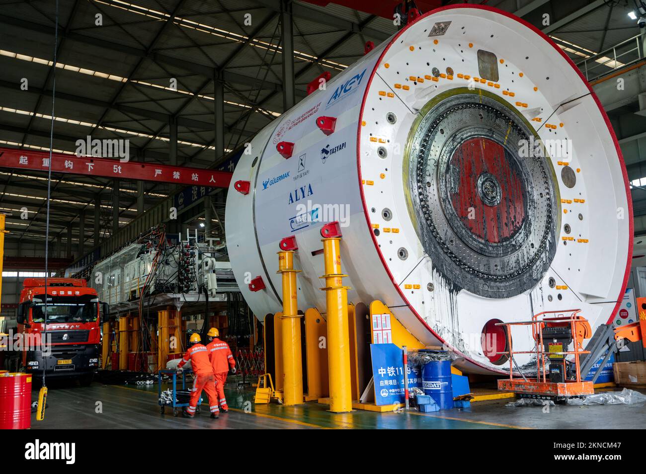 Zhengzhou. 27th Nov, 2022. Employees transport the components of a tunnel boring machine at a ...