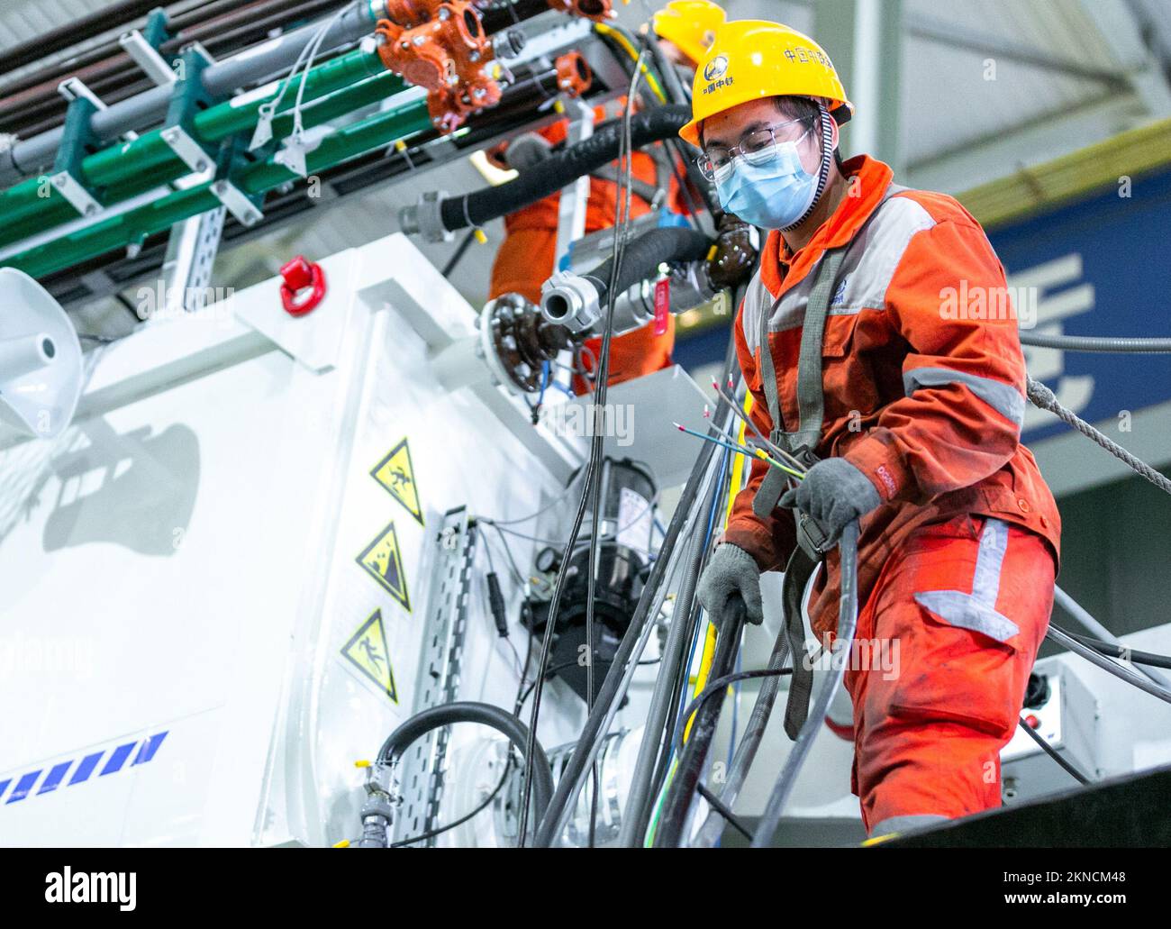 Zhengzhou. 27th Nov, 2022. An employee works on a tunnel boring machine at a workshop of China ...