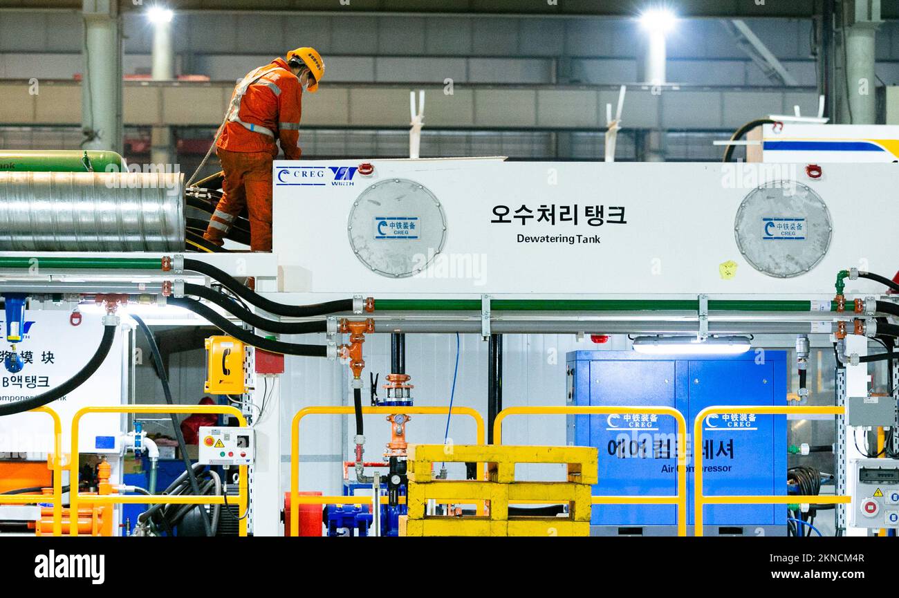 Zhengzhou. 27th Nov, 2022. An employee debugs a tunnel boring machine at a workshop of China ...