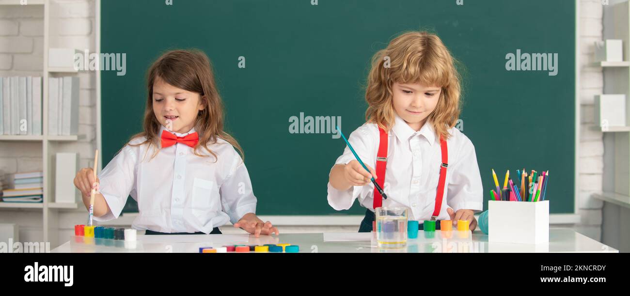 Portrait school kids doing art homework. Children drawing on elementary ...