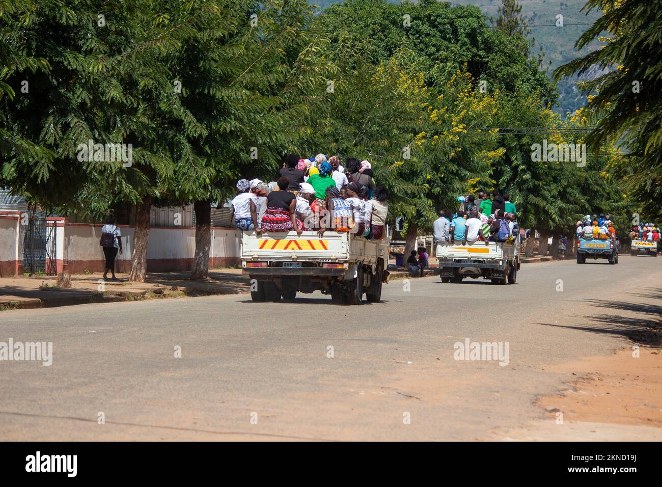 Buses overcrowded with people in a funeral procession Stock Photo - Alamy