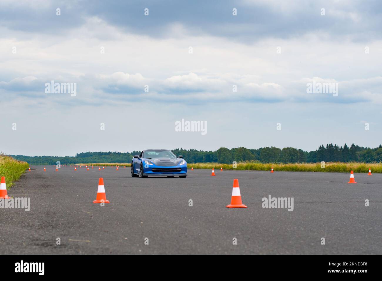 Modern car at test track, focus on traffic cone. Driving school Stock ...