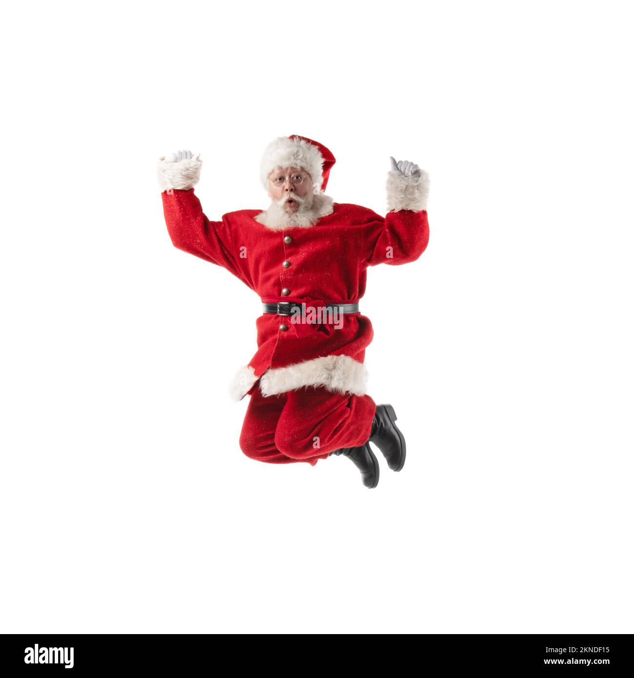 Santa Claus jumping, full length portrait isolated on white background ...
