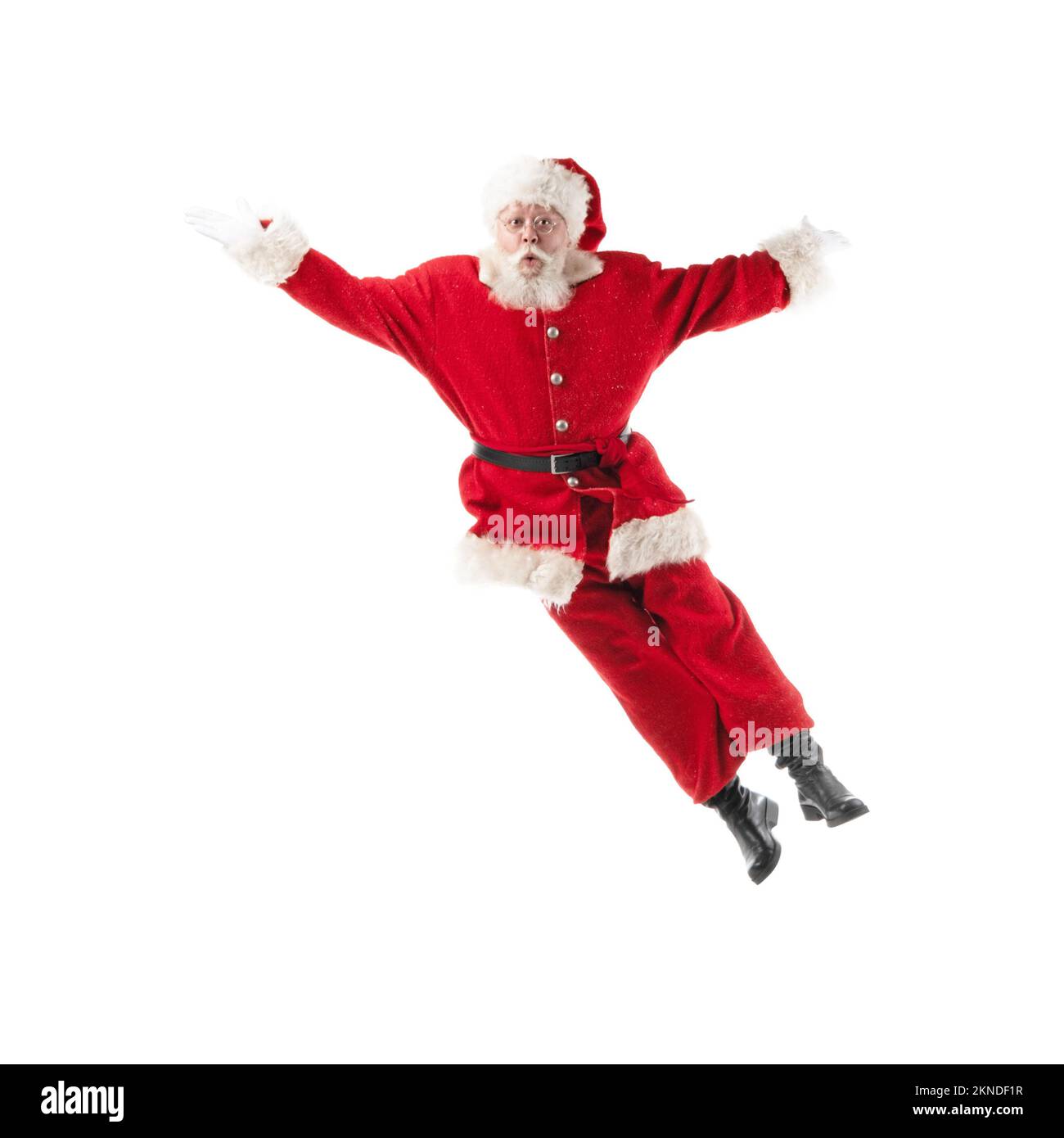 Santa Claus jumping, full length portrait isolated on white background ...