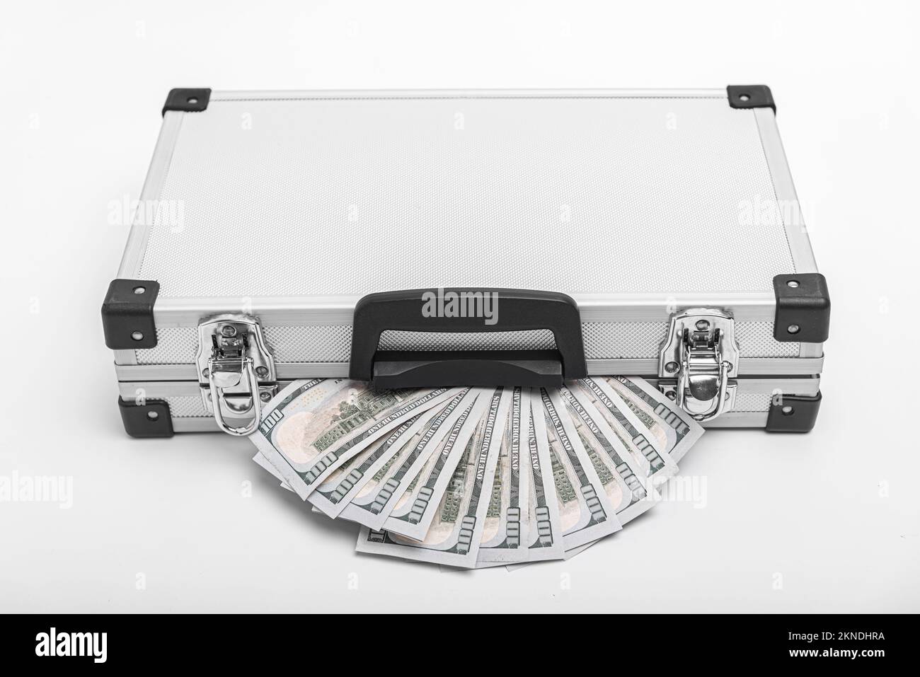 Suitcase with money on a white background Stock Photo - Alamy