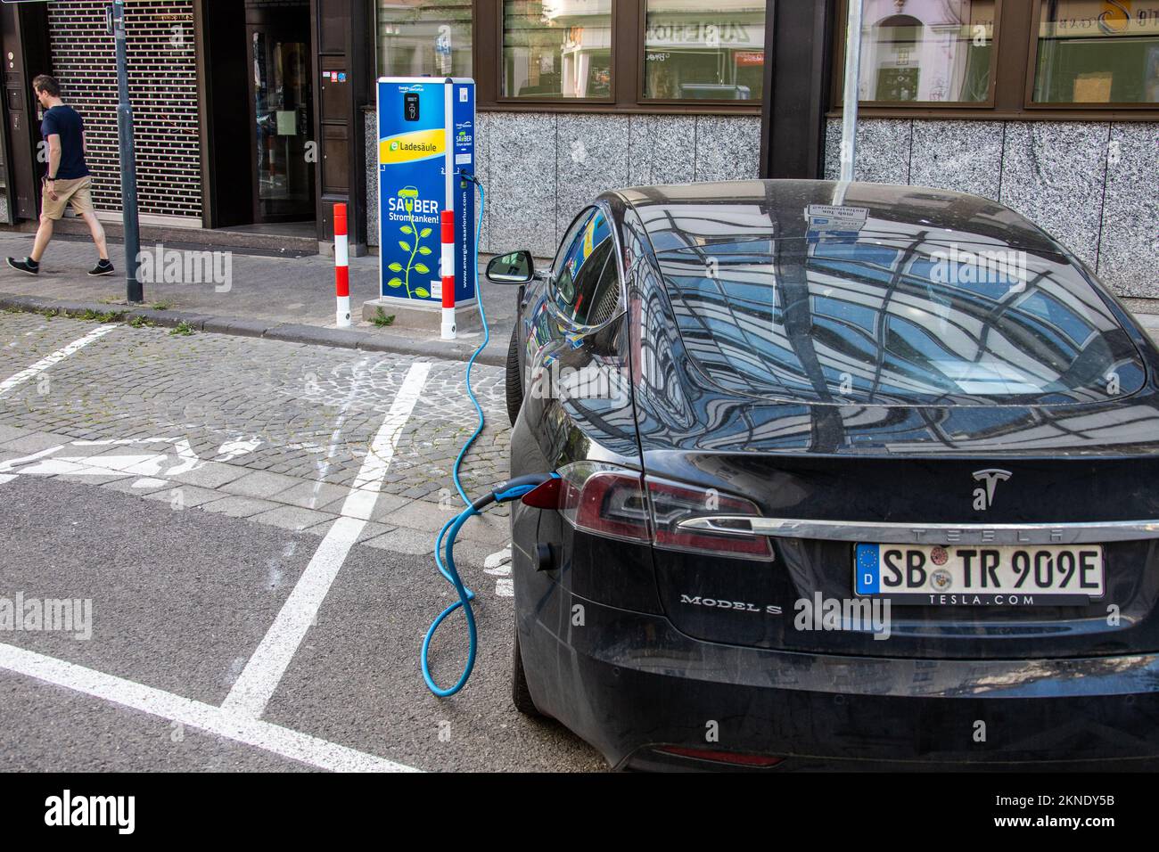 Tesla charging at a Ladesaule EV electric vehicle charger, Saarbruck ...