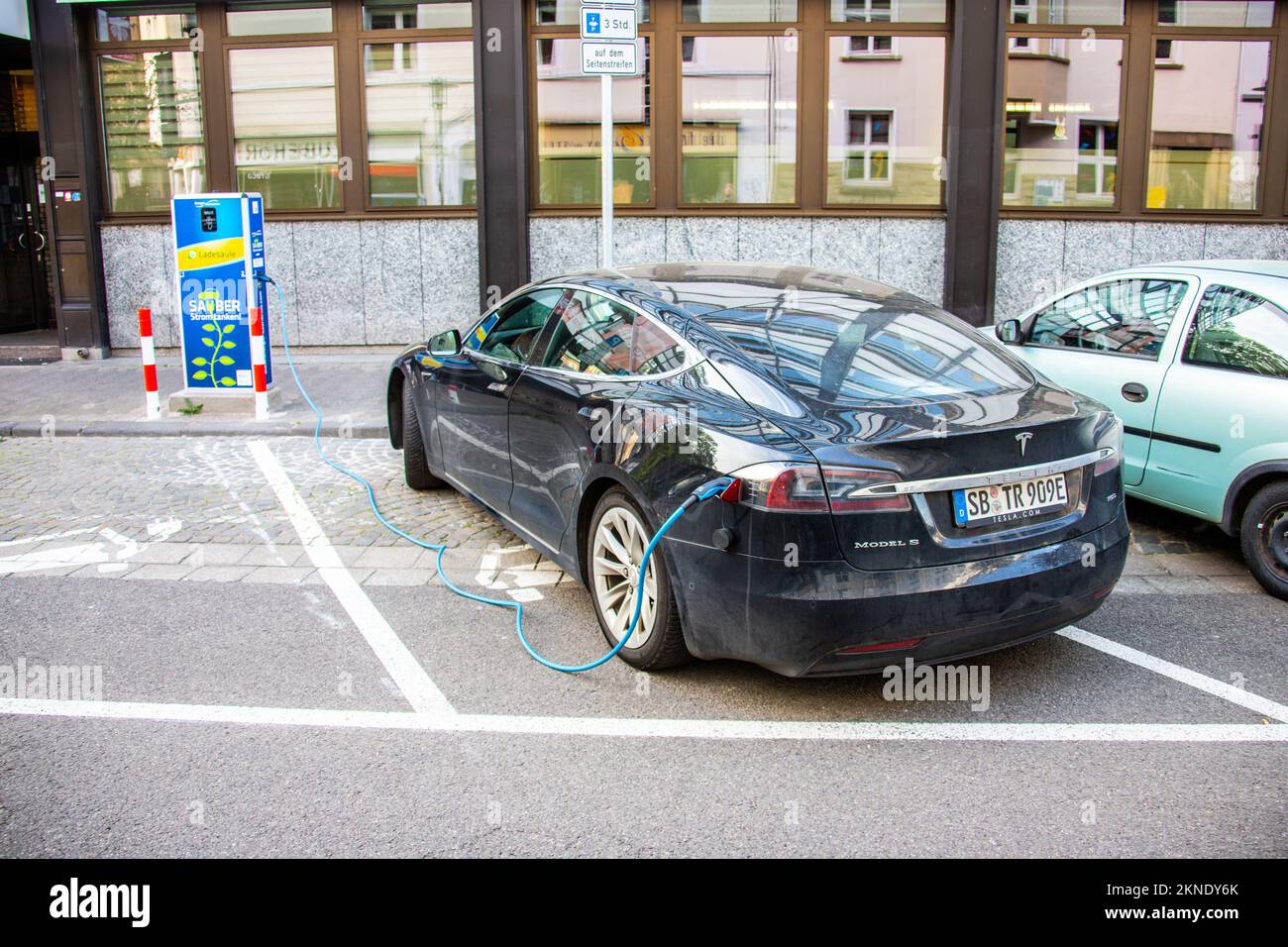 Tesla charging at a Ladesaule EV electric vehicle charger, Saarbruck ...