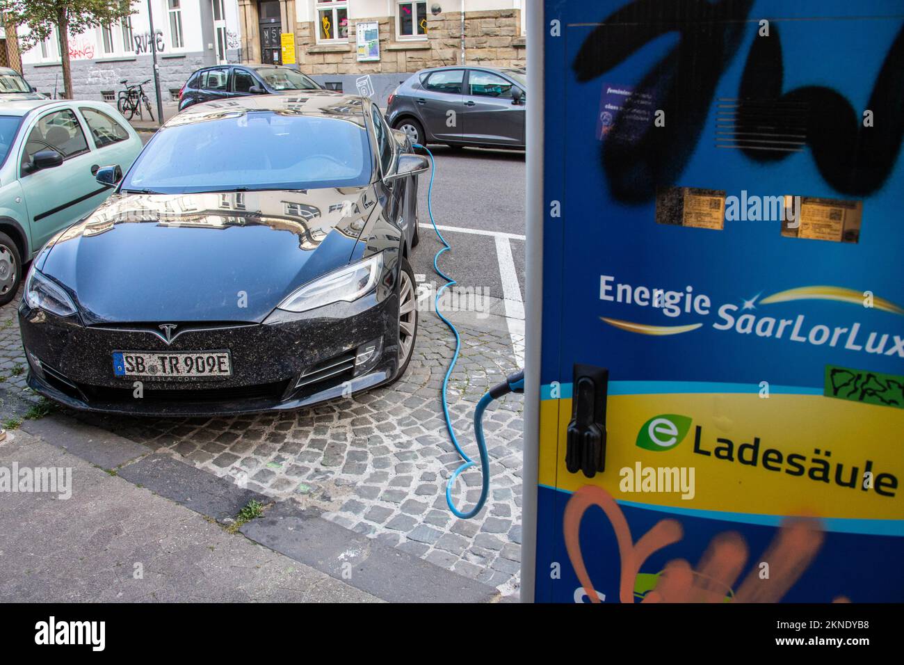 Tesla charging at a Ladesaule EV electric vehicle charger, Saarbruck ...