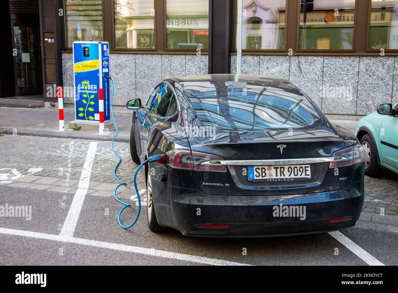 Tesla charging at a Ladesaule EV electric vehicle charger, Saarbruck ...